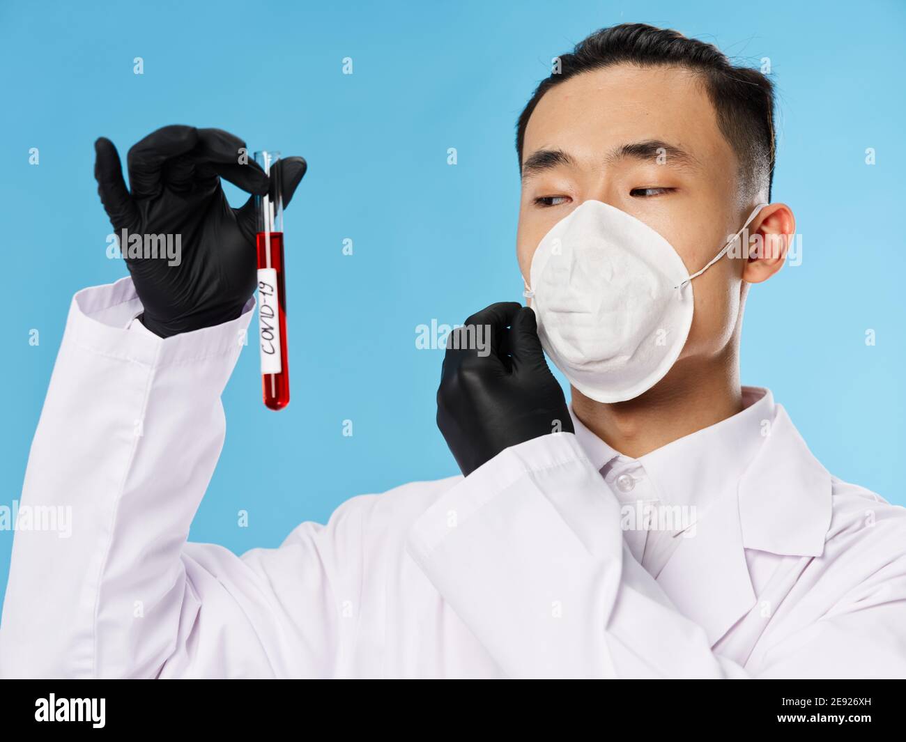 Male laboratory assistant medical mask protection research blue ...