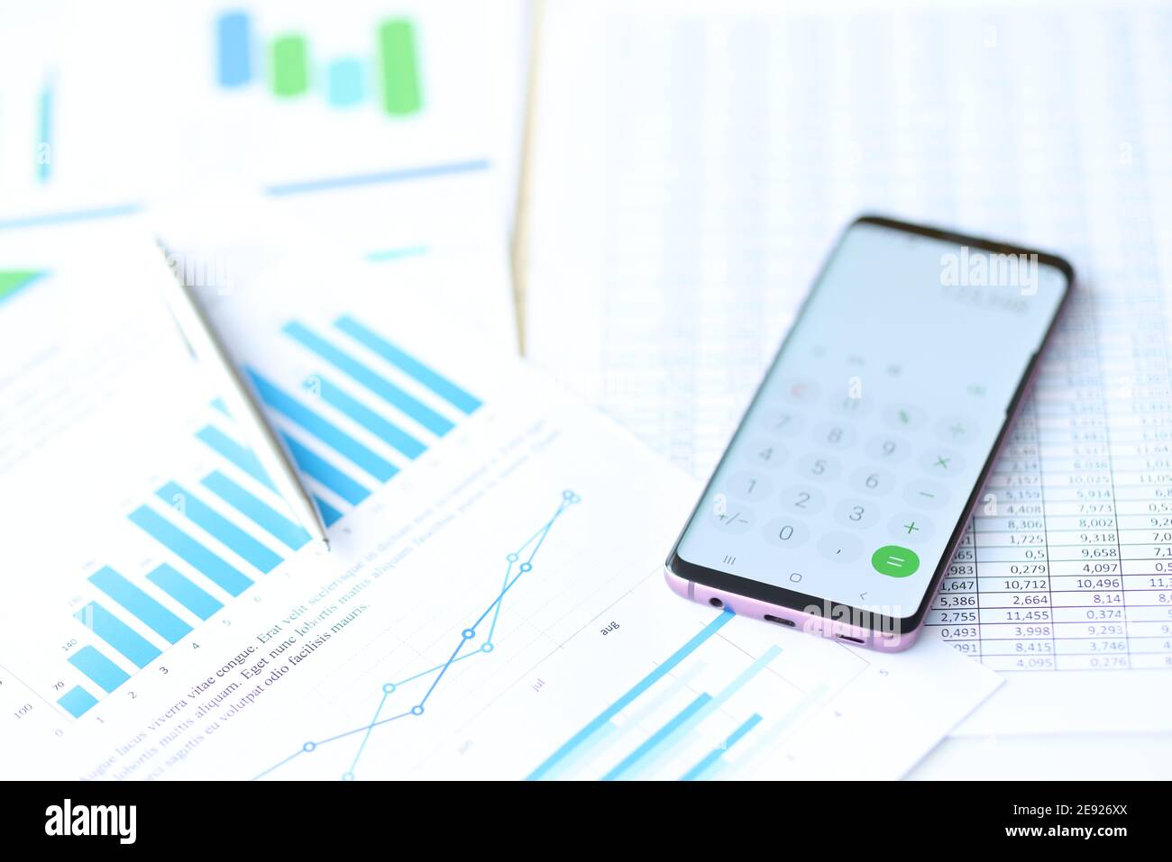 Mobile phone lying on documents with schedules closeup Stock Photo - Alamy