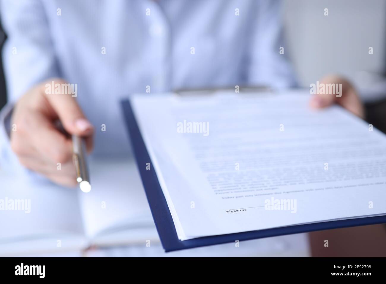 Female hand giving ballpoint pen for signing contract closeup Stock ...