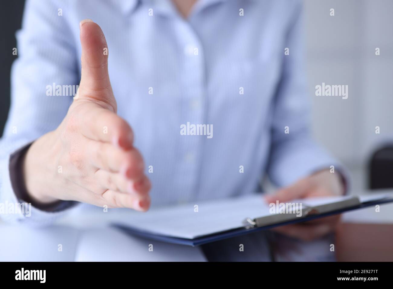 Woman stretching out her hand for handshake closeup Stock Photo - Alamy