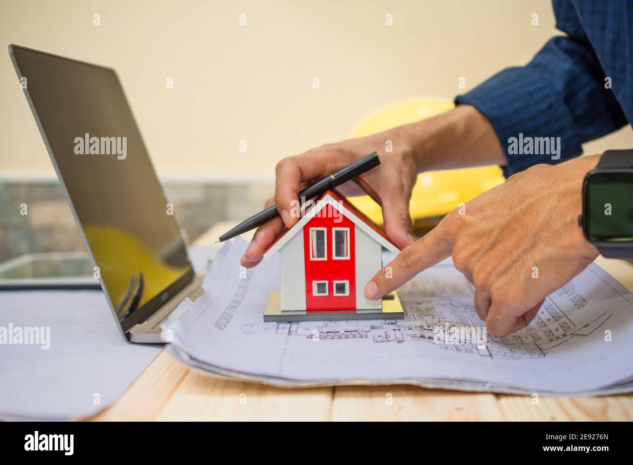 Engineer check drawing blueprint to work for building construction ...