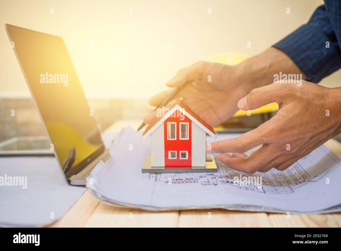 Engineer check drawing blueprint to work for building construction ...