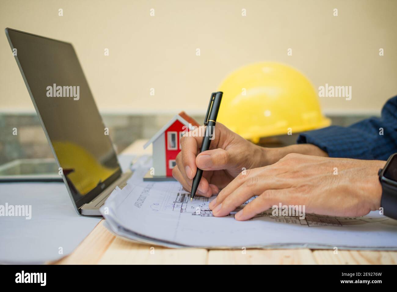 Engineer check drawing blueprint to work for building construction ...