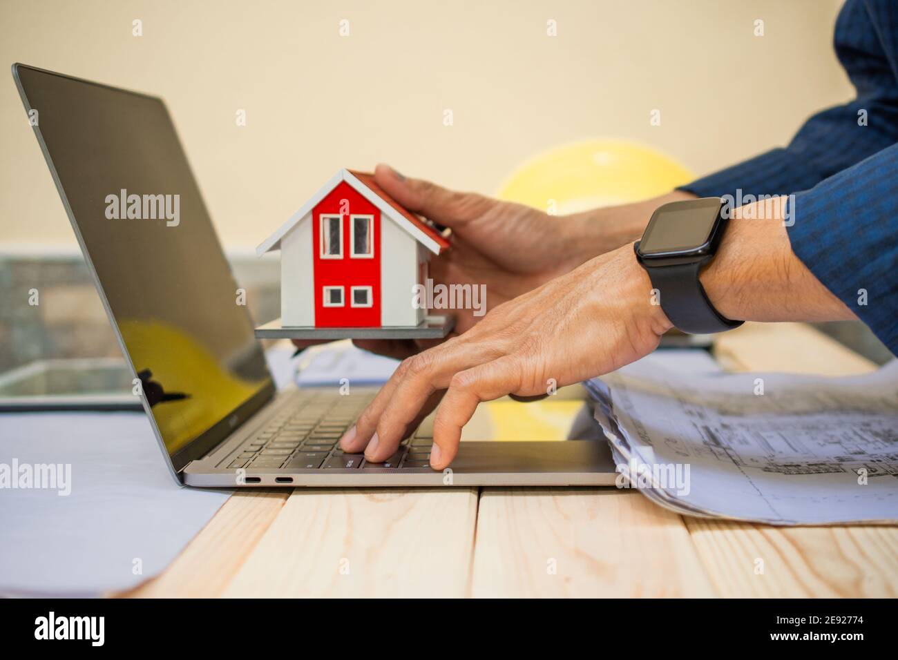 Engineer check drawing blueprint to work for building construction ...