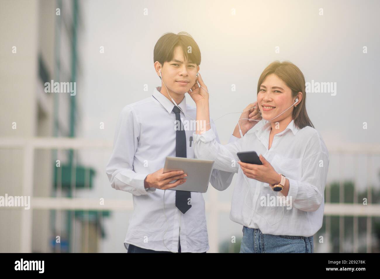 Asian people use mobile smart phone tablet smart technology soft focus ...