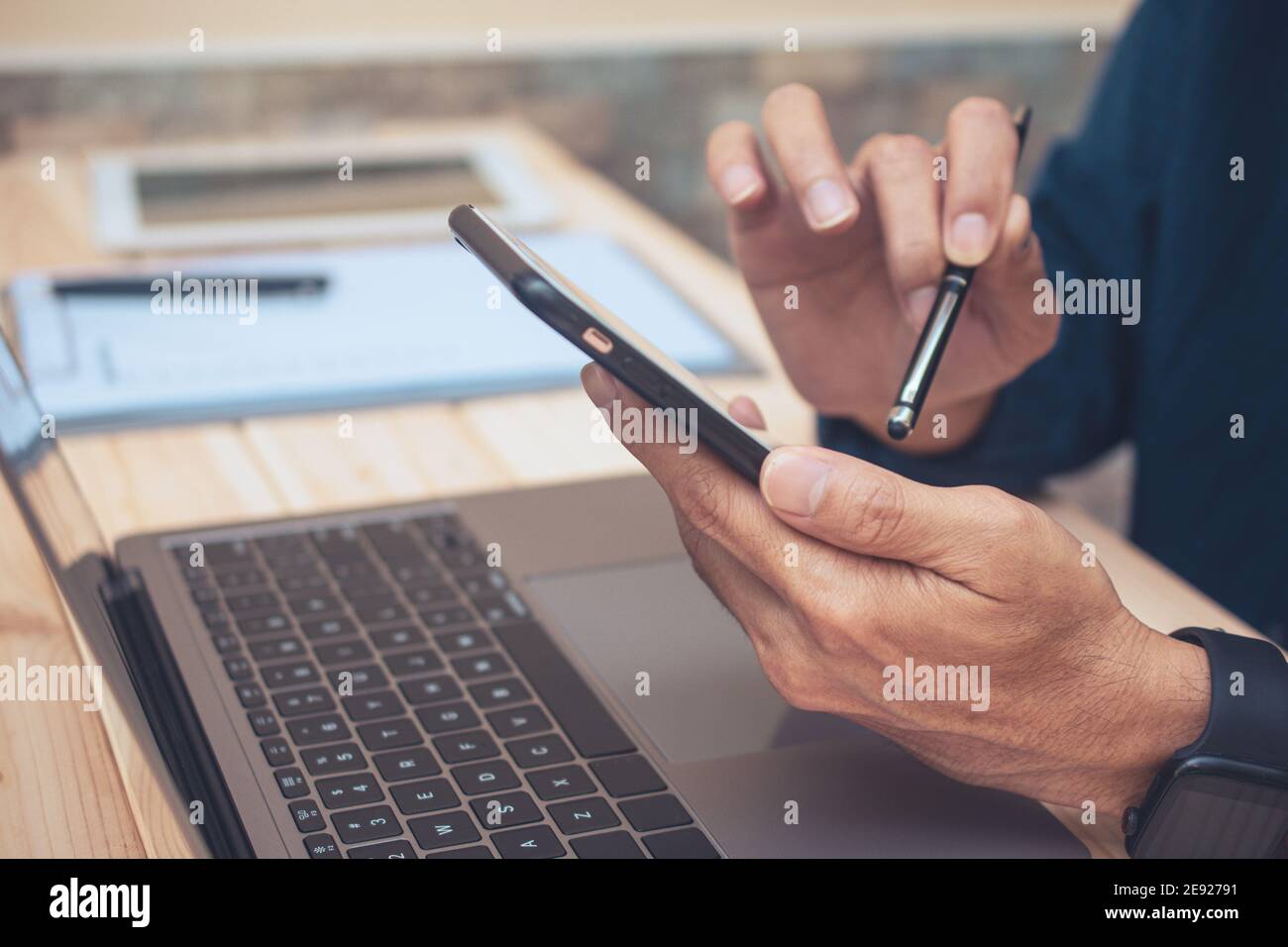 People use mobile phone , Hand holding smartphone working in office ...