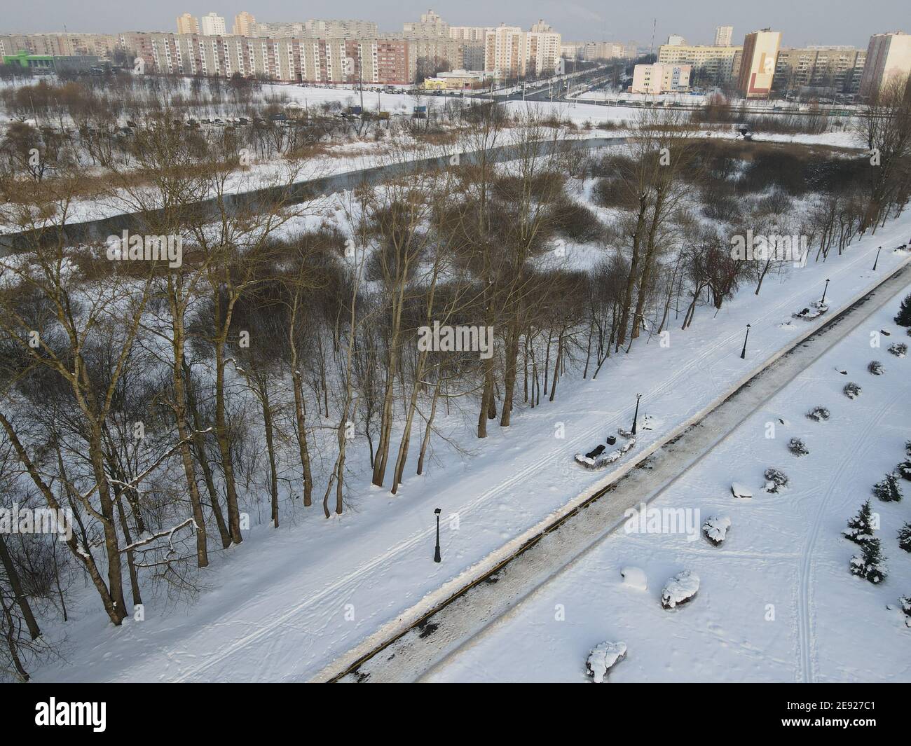 Urban winter landscape from above. Multi-storey buildings and trees in ...