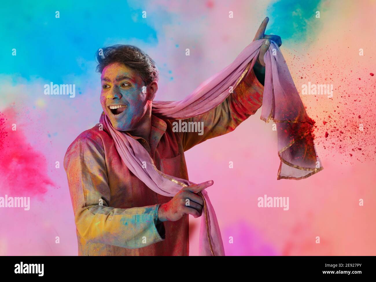 Man with gulal on his face dancing in excitement on Holi Stock Photo ...