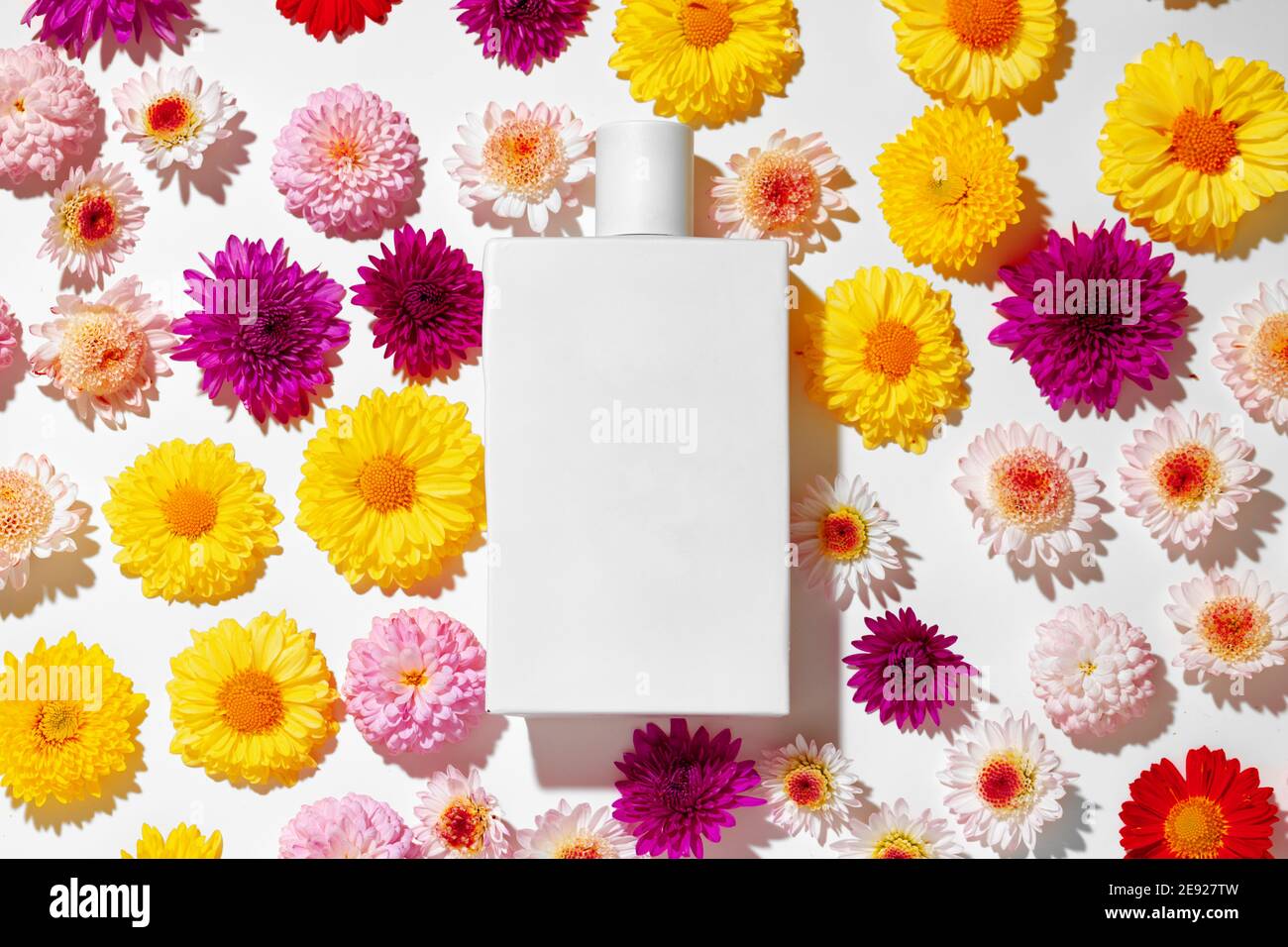 Perfume bottle for women in flower buds Stock Photo - Alamy
