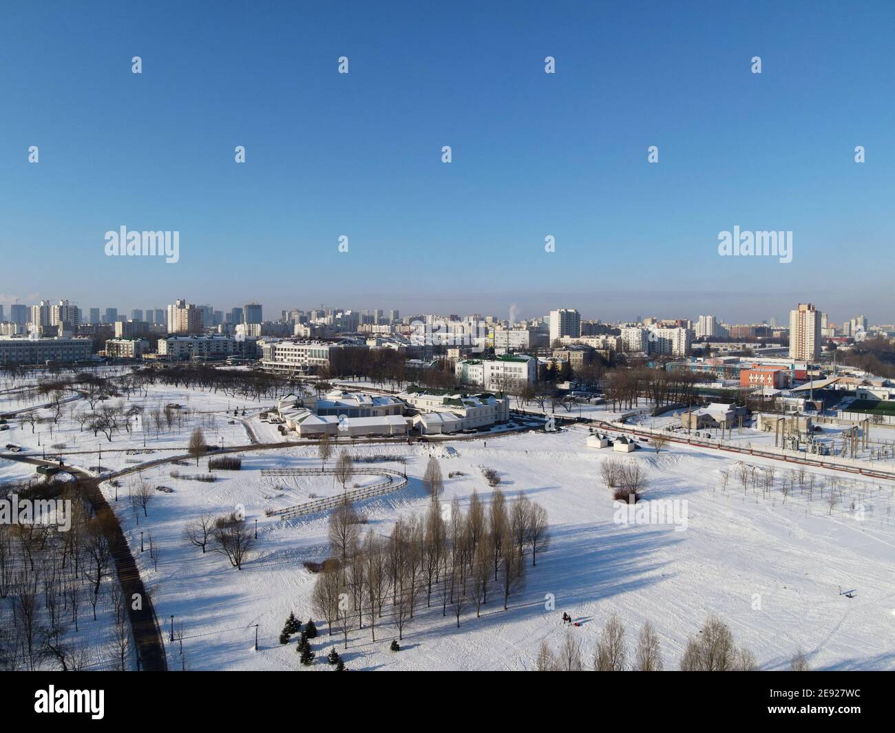 Urban winter landscape from above. Multi-storey buildings and trees in ...
