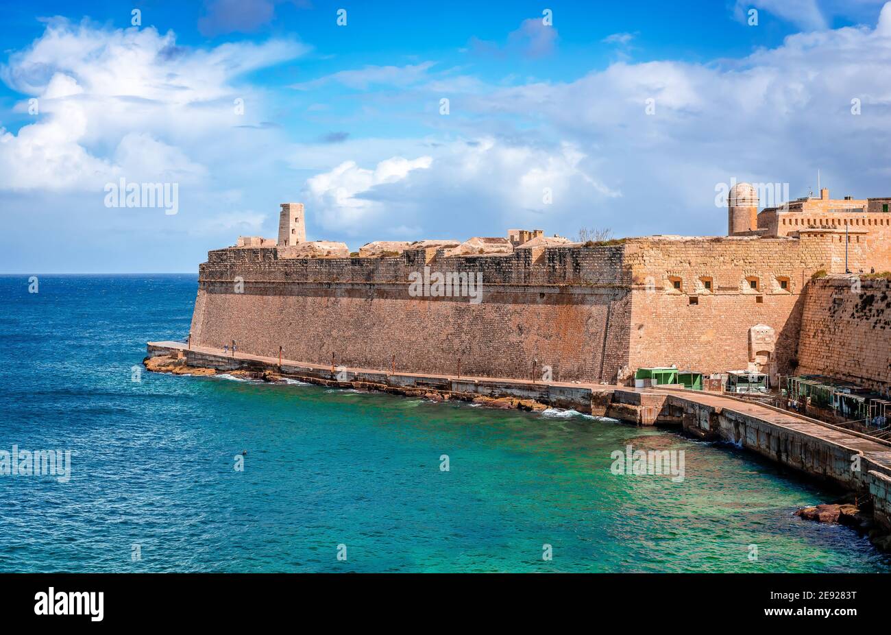 The Saint Elmo Bay and the city walls of Valletta, in Malta Stock Photo ...