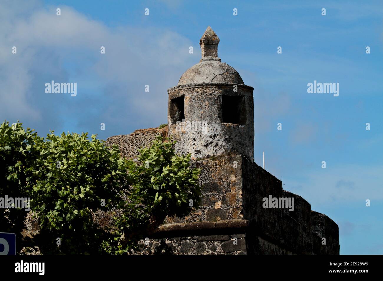 An old fortress with a tower and green tree tops Stock Photo - Alamy
