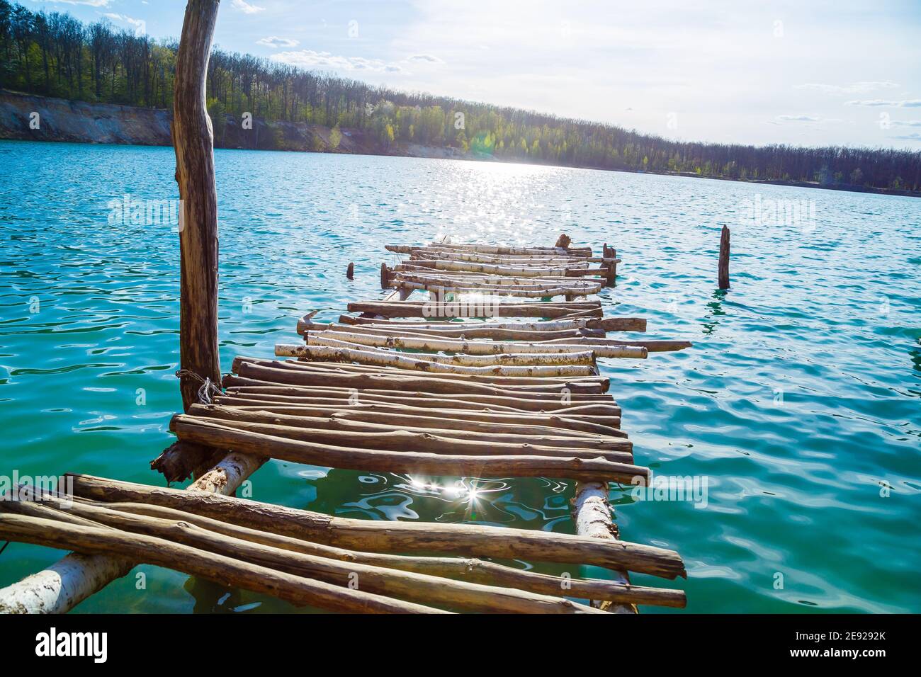 Wooden masonry stands on the water isolated. Entry into the lake from a ...