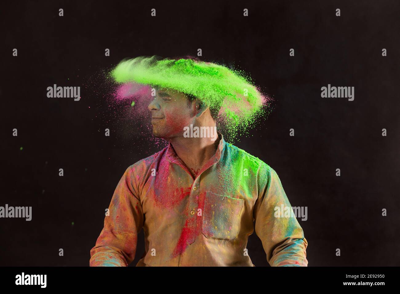 Man celebrating Holi with colors in his hair Stock Photo - Alamy