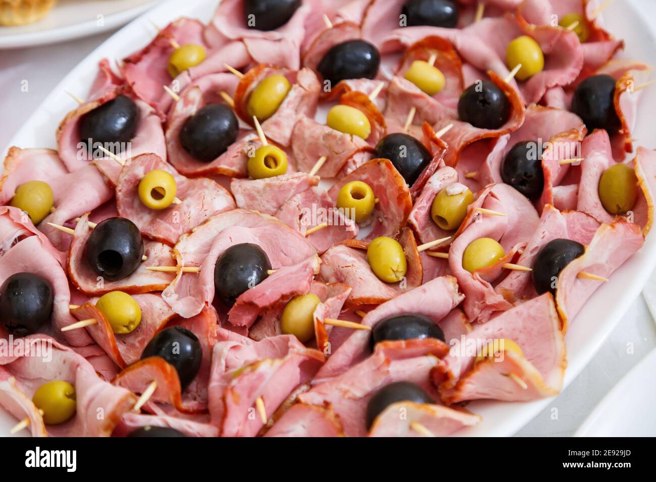 Nicely decorated banquet table with a variety of snacks and sandwich ...