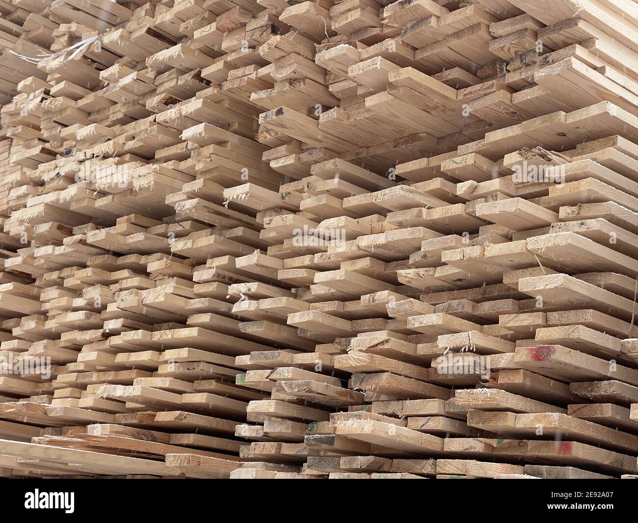 Close up of wooden boards in snowy weather. Texture of industrial ...