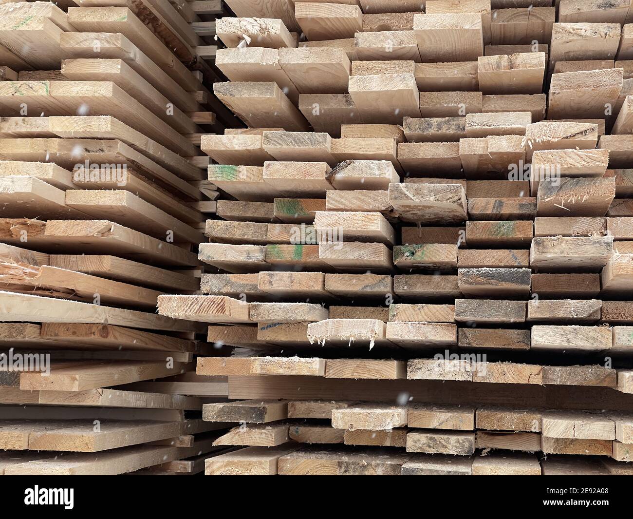 Close up of wooden boards in snowy weather. Texture of industrial ...
