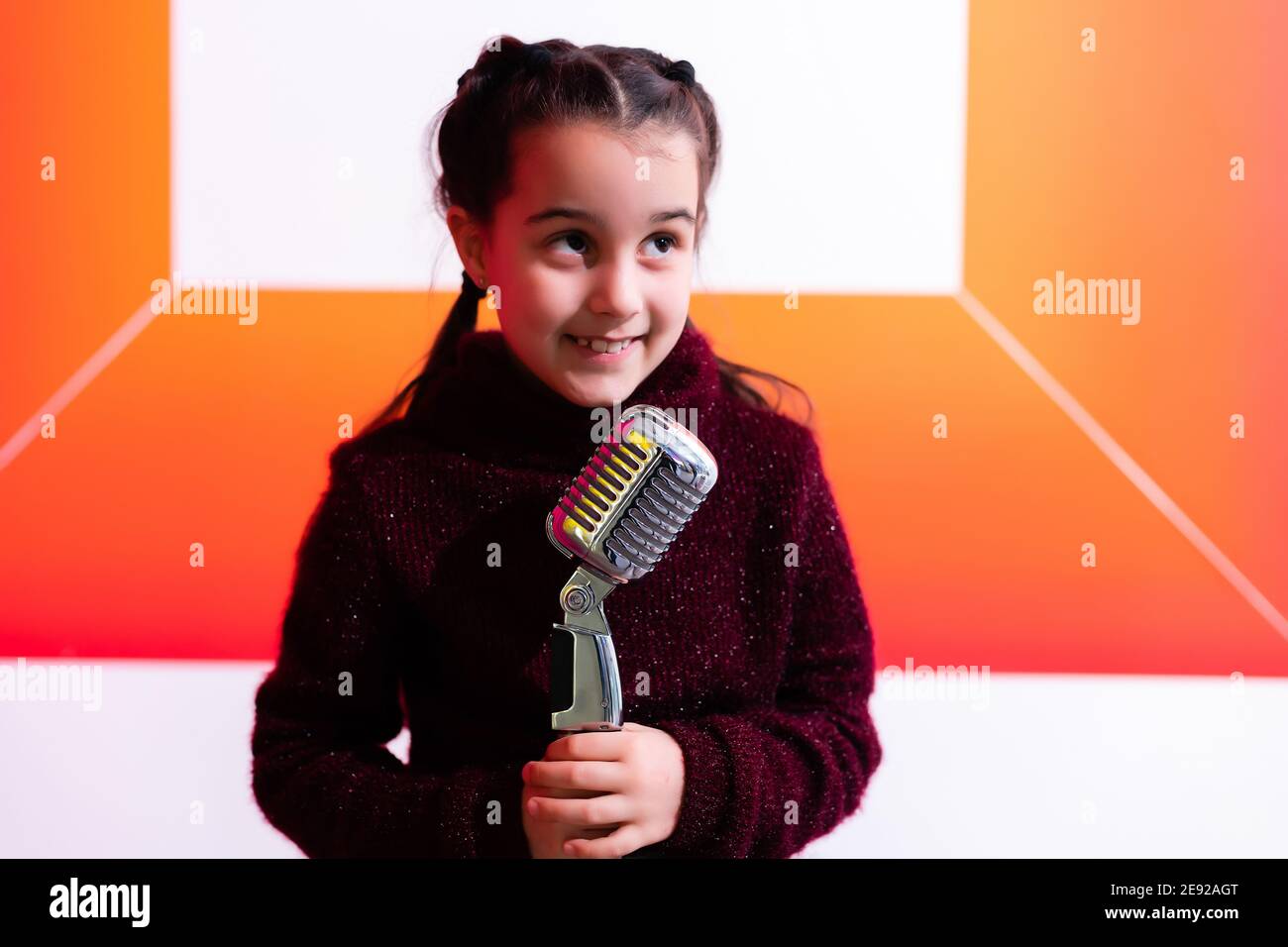 Regording studio. Child girl singing or role voicing Stock Photo - Alamy