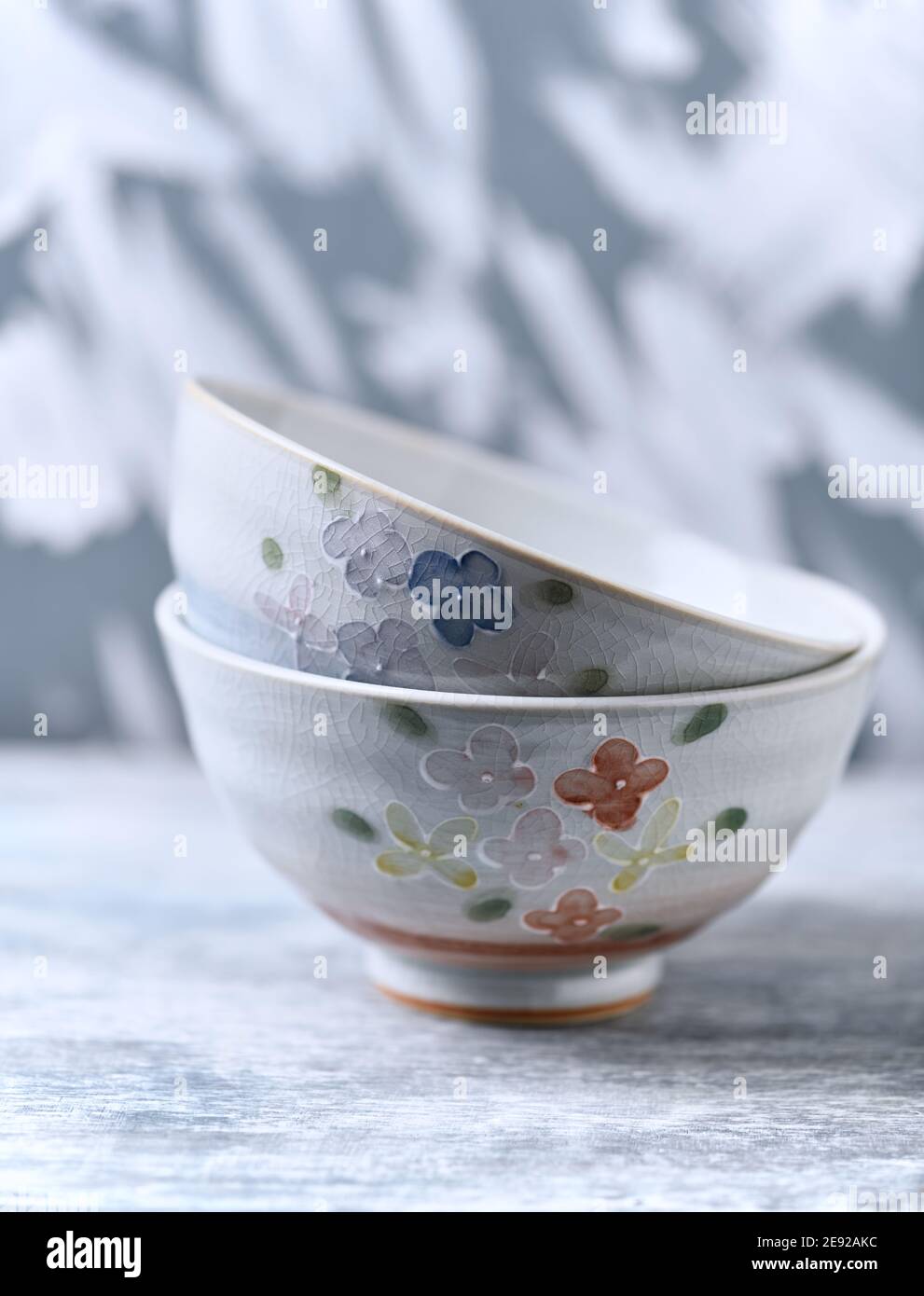 Traditional ceramic bowls on bright background Stock Photo - Alamy