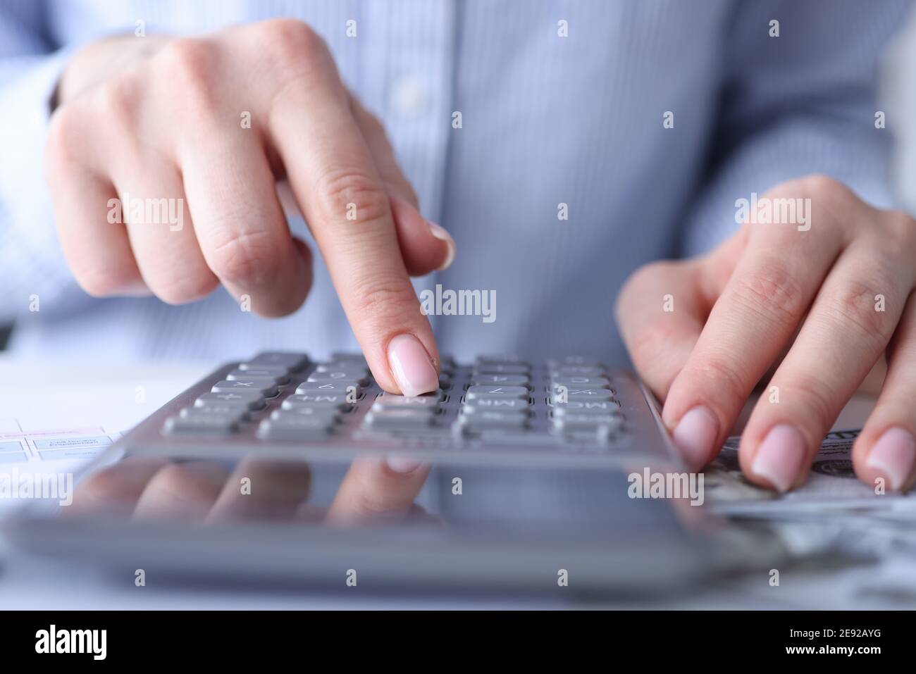 Female hands are counting on calculator at table closeup Stock Photo ...