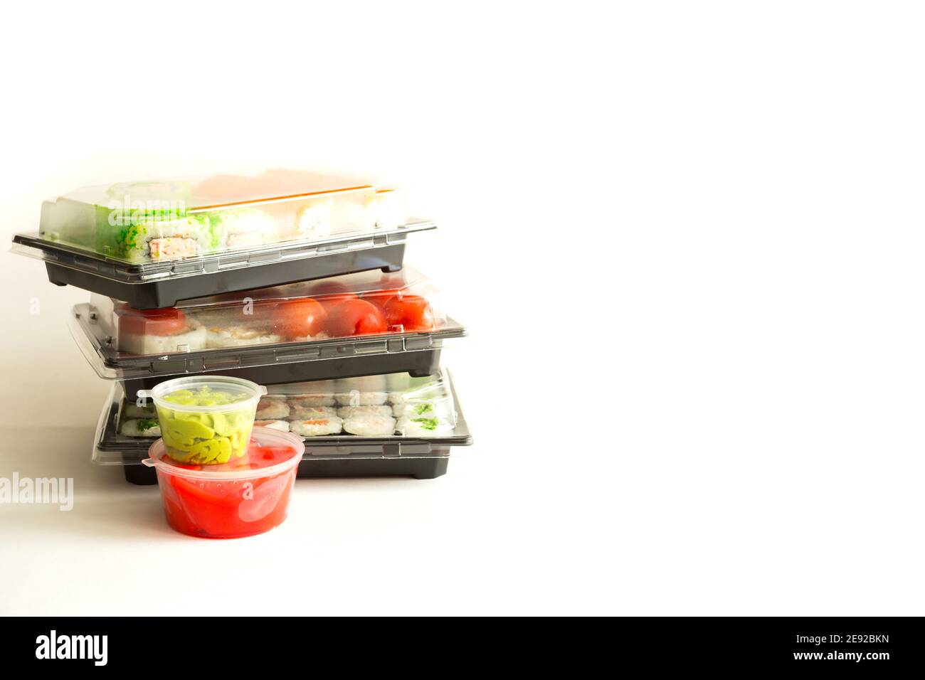 Sushi and rolls in a shipping container. Delivery of Japanese cuisine ...