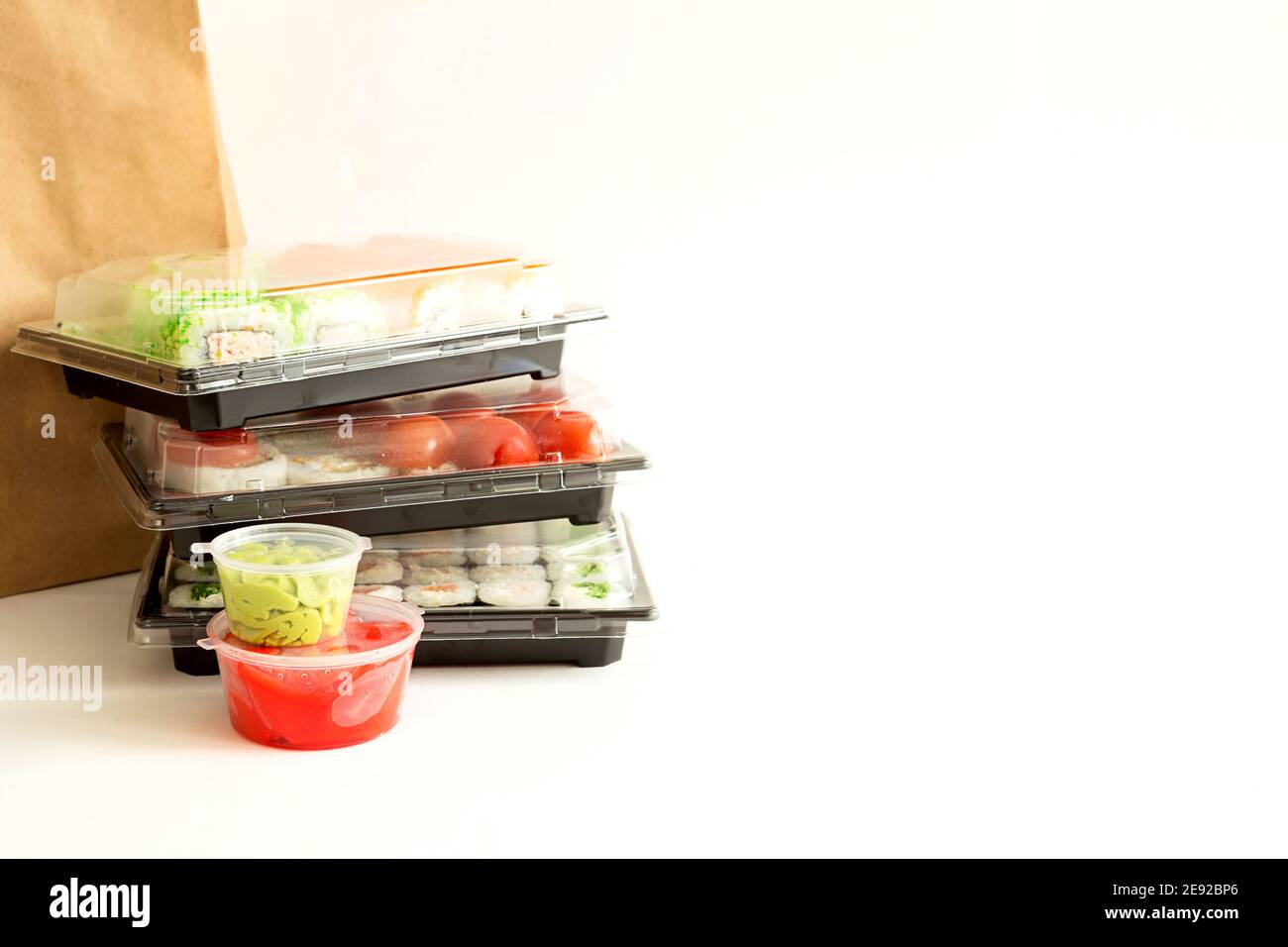 Sushi and rolls in a shipping container. Delivery of Japanese cuisine ...