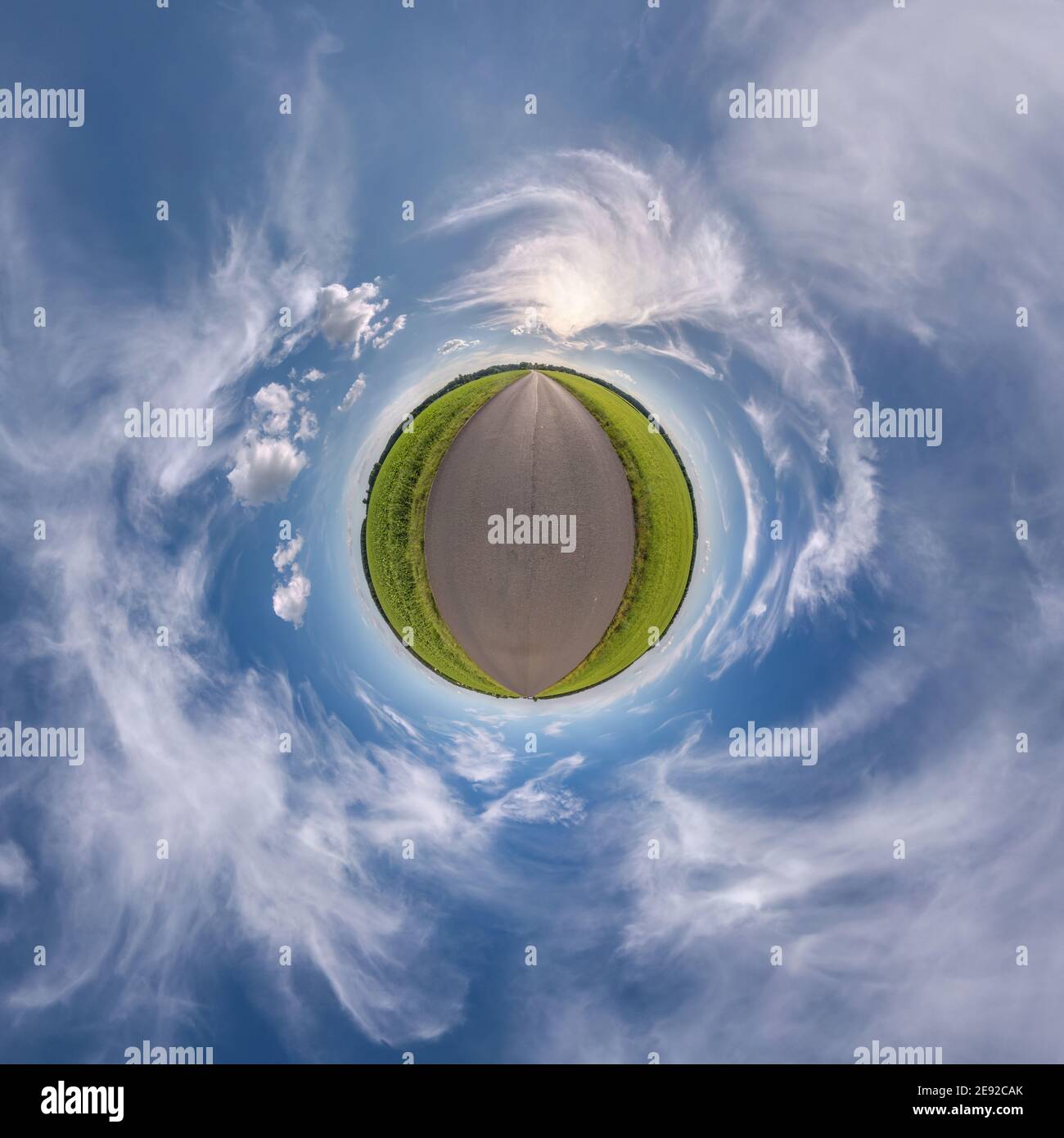 tiny planet in blue sky with sun and beautiful clouds. Transformation ...
