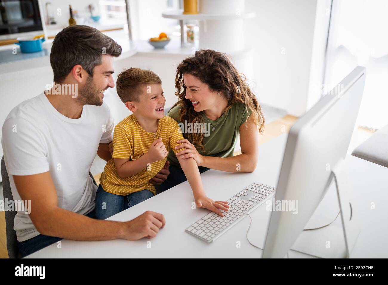 Parents helping to children studying online at home. Lockdown and ...