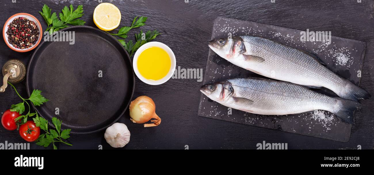 fresh fish with ingredients for cooking dark background, top view Stock ...