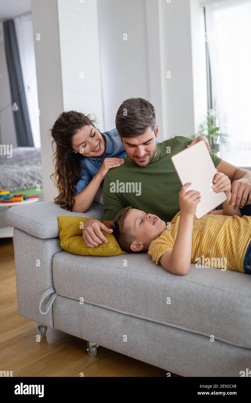Parents helping to children studying online at home. Lockdown and ...