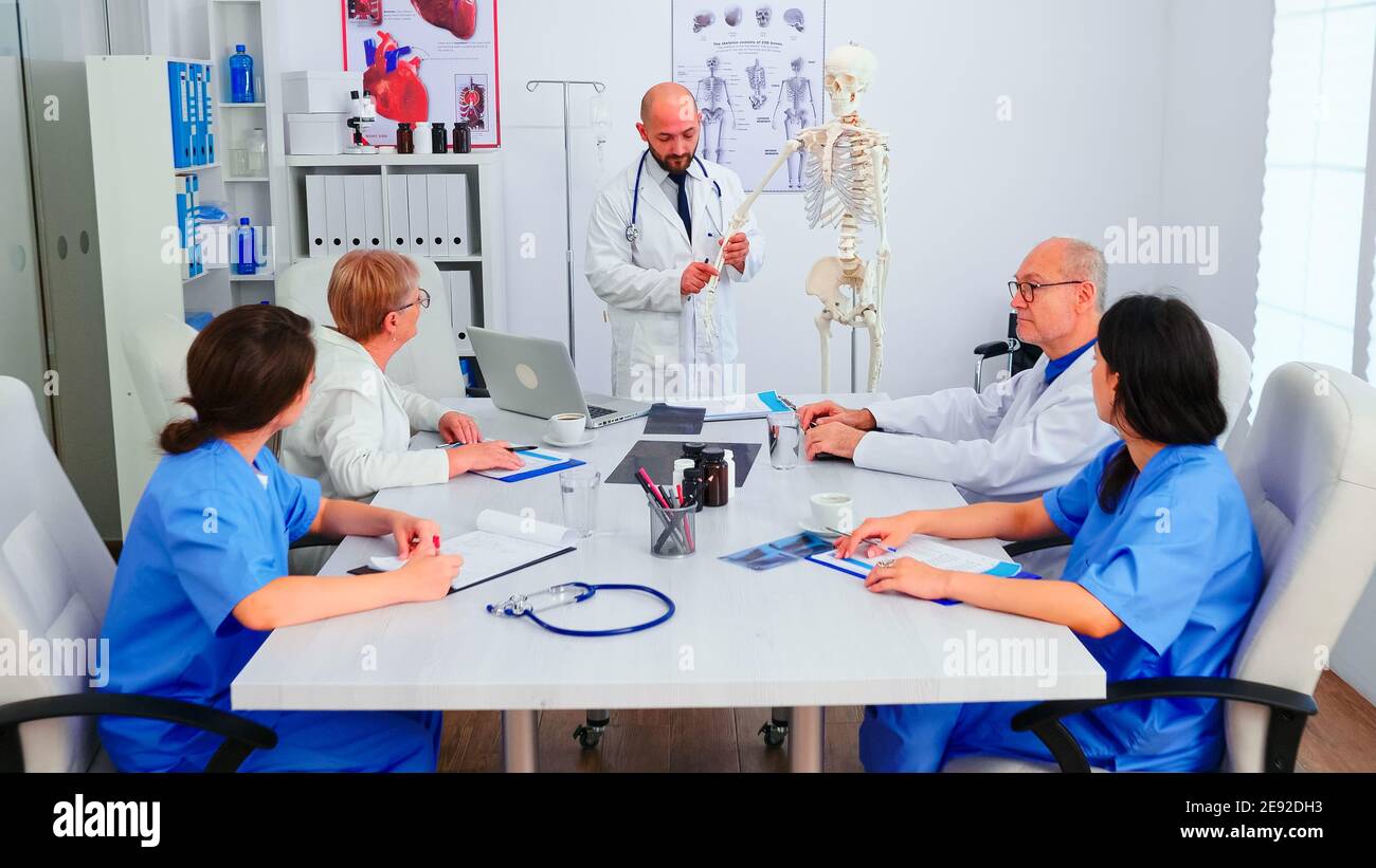 Expert doctor holding radiography during medical seminar for medical ...