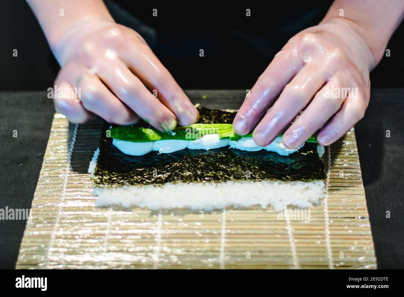 Sushi chef making maki and sashimi sushi at a sushi restaurant Stock ...