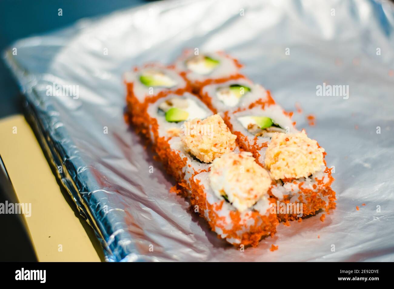 Sushi chef making maki and sashimi sushi at a sushi restaurant Stock ...
