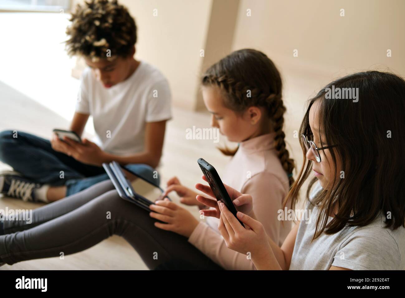 Electronic devices, children hi-res stock photography and images - Alamy