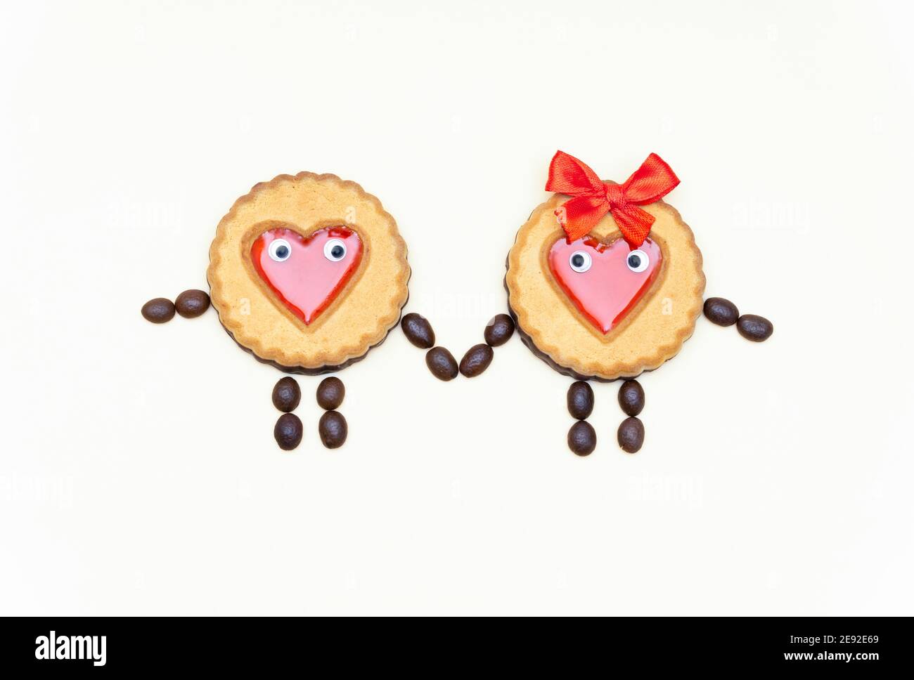 Funny couple made of cookies and coffee beans holding hands. Creative ...