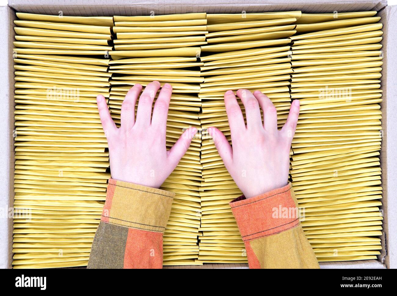 Top view of female hands counting office mail envelopes neatly packed ...