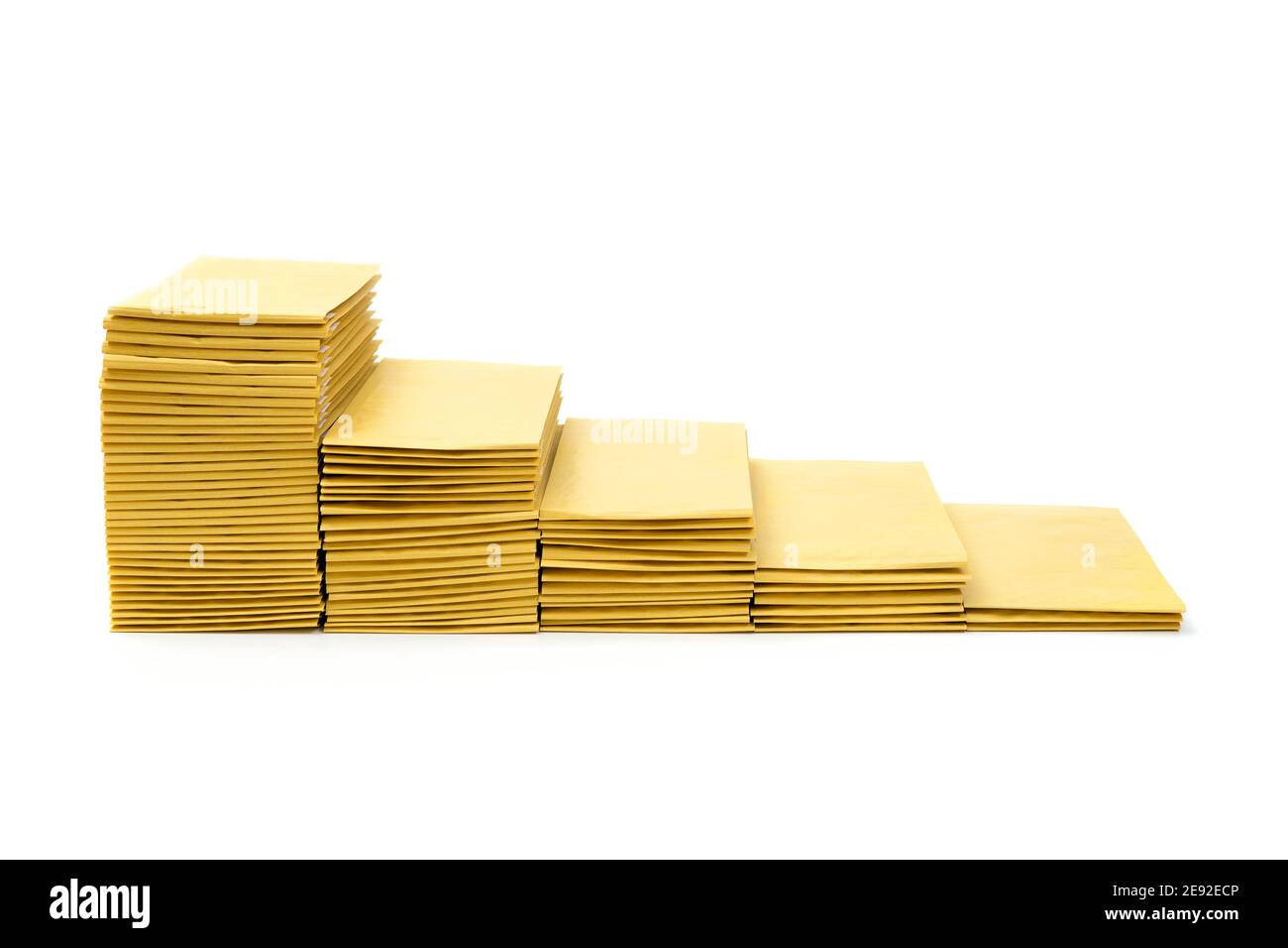 Side view of five stacks of yellow mail envelopes arranged in ...