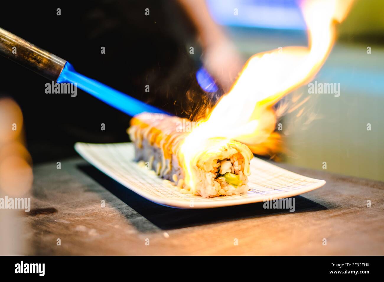 Sushi chef making maki and sashimi sushi at a sushi restaurant Stock ...