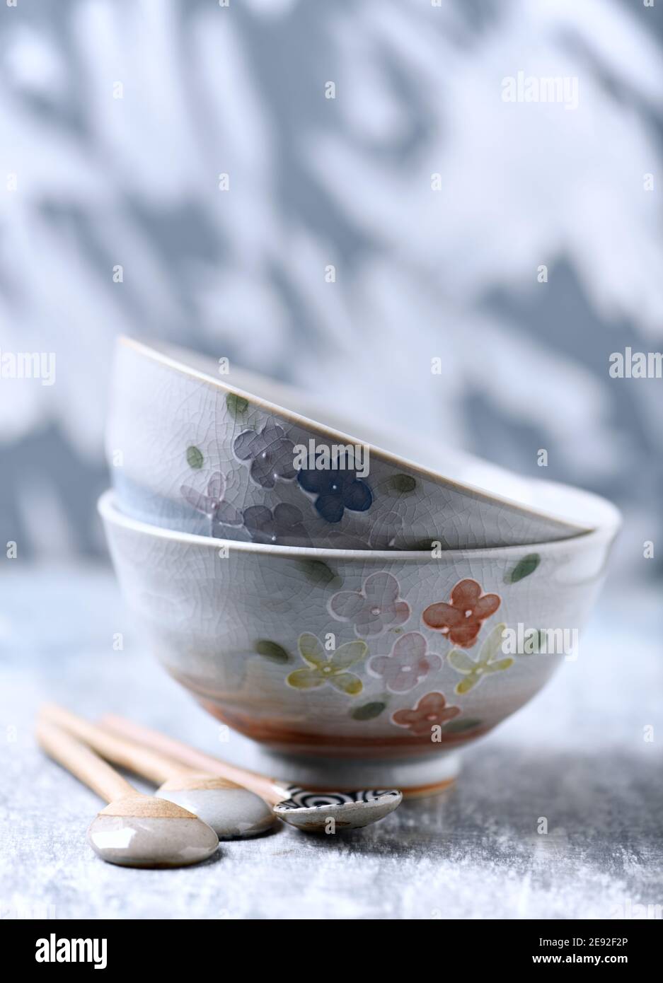 Traditional ceramic bowls on bright background Stock Photo - Alamy