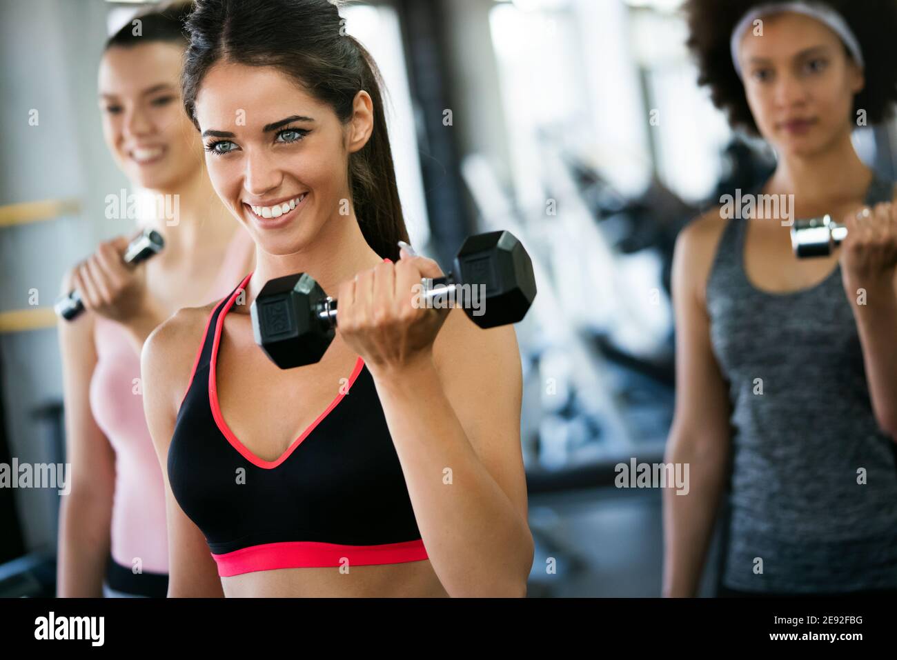 Group of fit people at the gym exercising Stock Photo - Alamy