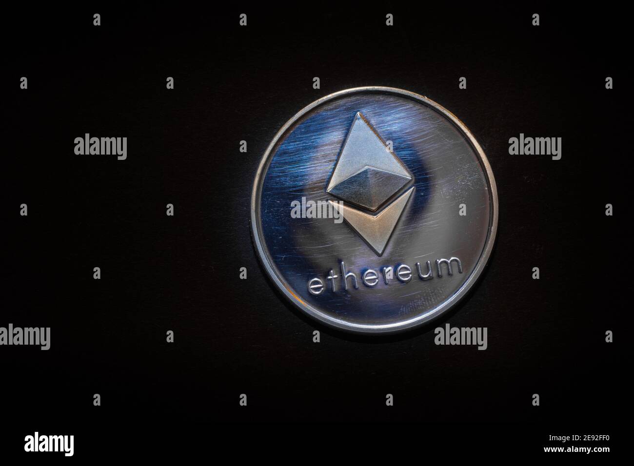 single ehter coin cryptocurrency on black background front Stock Photo ...
