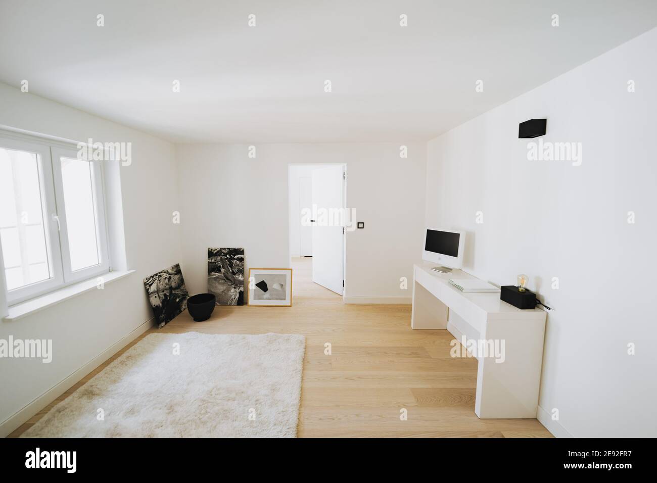 a modern white room with a white computer desk Stock Photo - Alamy