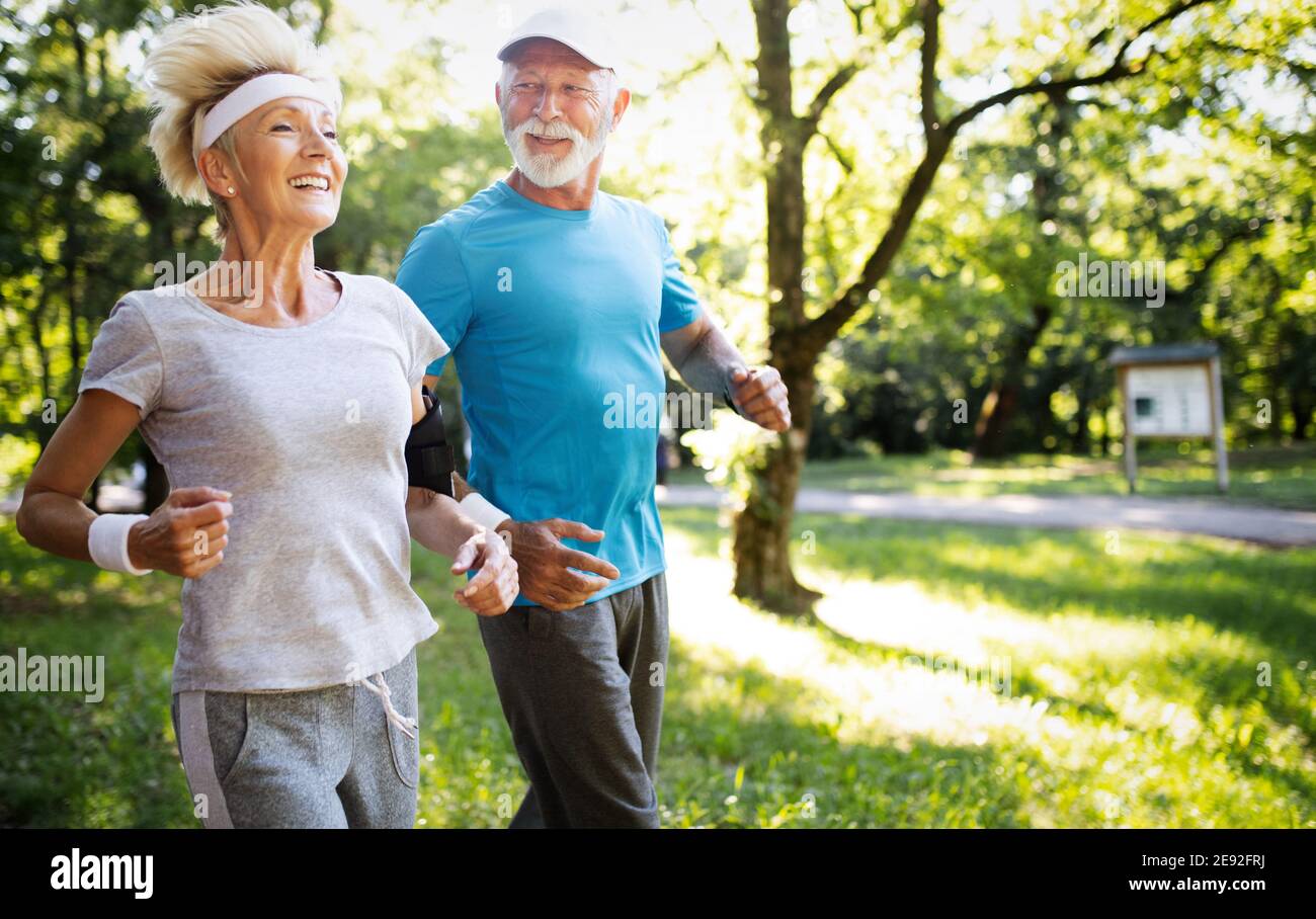 Happy mature people couple exercising for healthy life Stock Photo - Alamy