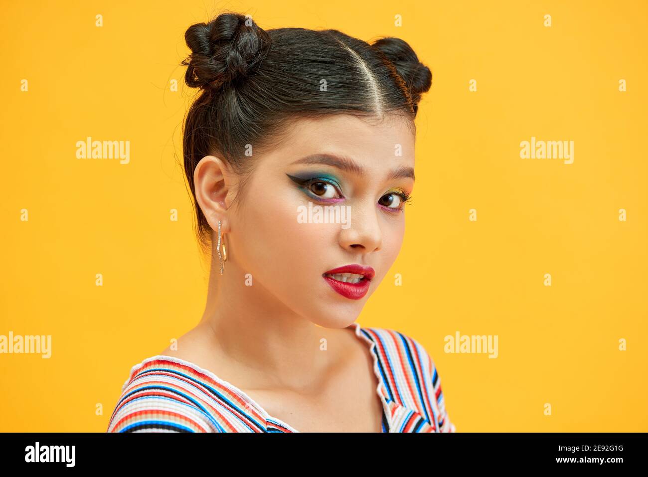 Young woman studio fashion portrait. Bright vibrant colors Stock Photo ...