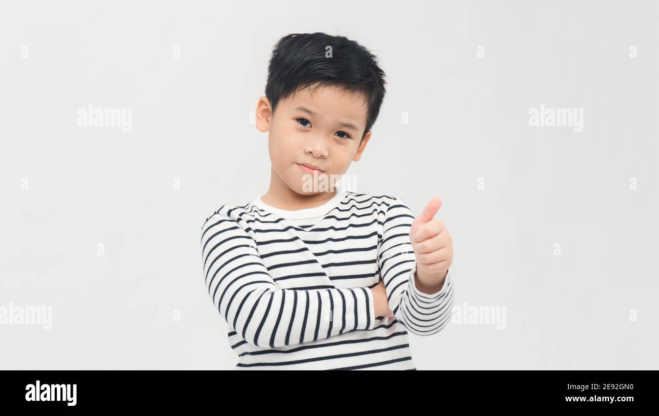 Asian little boy isolated smiling and raising thumb up Stock Photo - Alamy