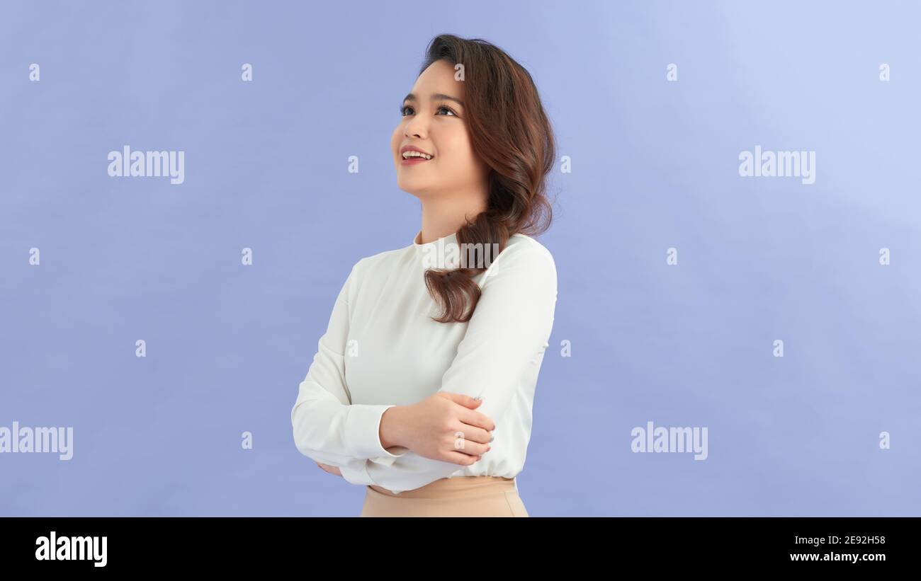 The young woman's portrait with happy emotions on lilac background ...