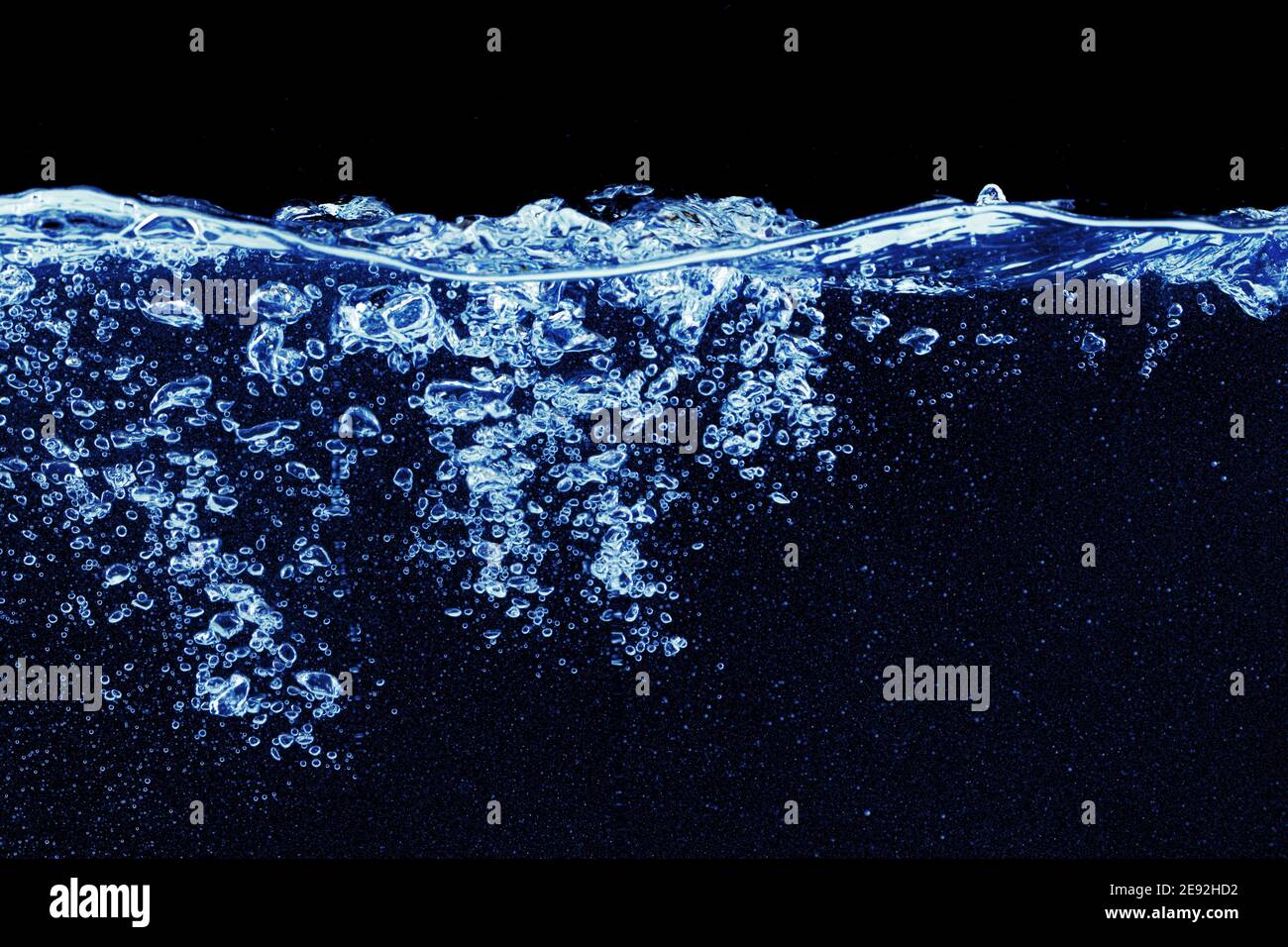 Water splash in aquarium isolated on black background Stock Photo - Alamy