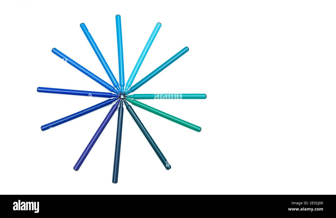 Circle of blue colored markers on isolated background. Different shades ...