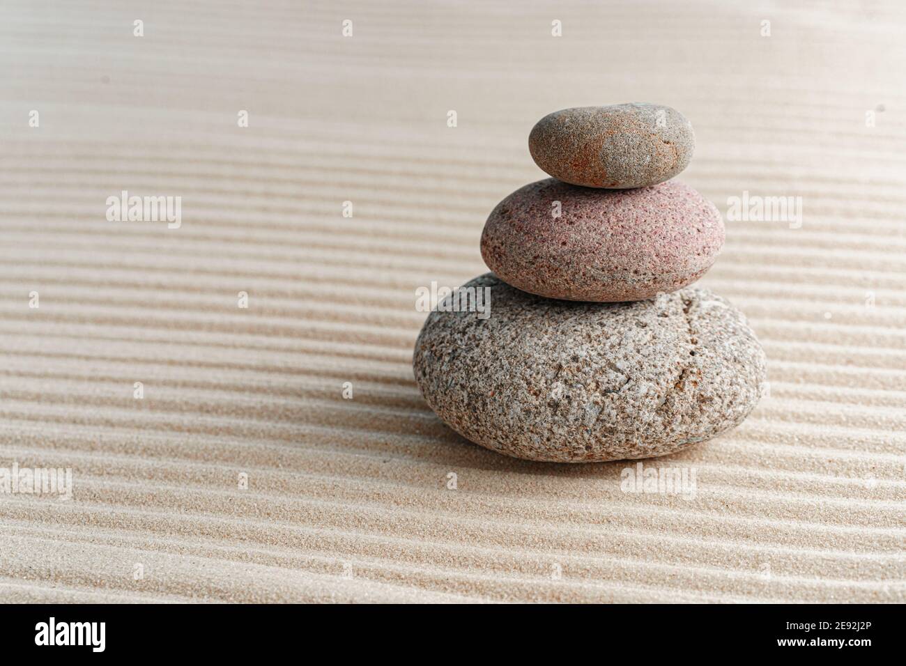 Stones on sand, japanese meditation zen garden Stock Photo - Alamy