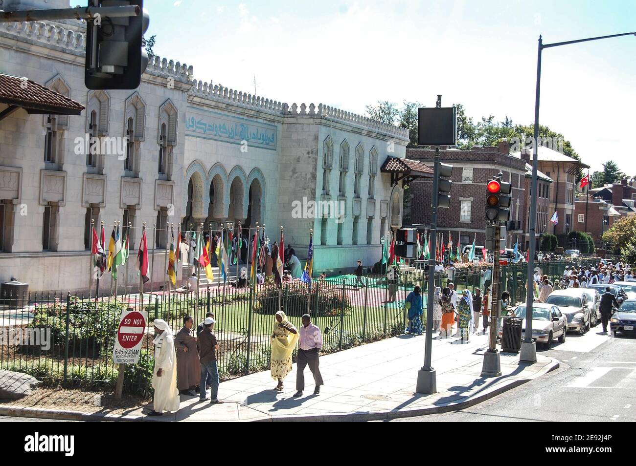 people walking to Mosque also flags and traffic lights in Embassy row ...